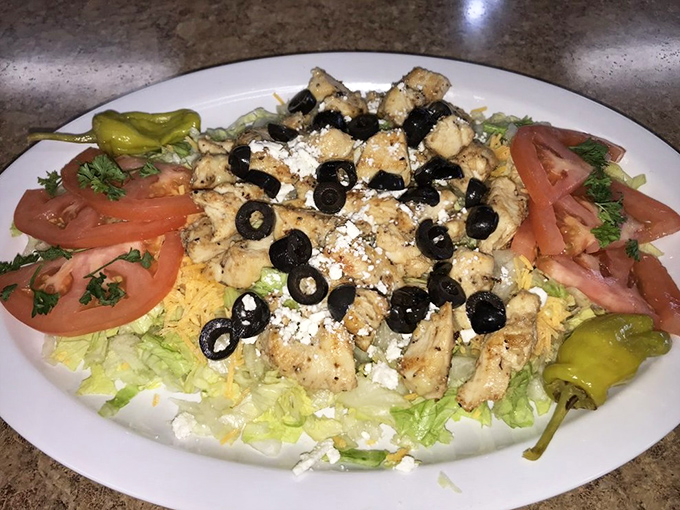 A Greek salad that looks like it vacationed in Oklahoma and decided to stay &ndash; fresh, colorful, and generously portioned.