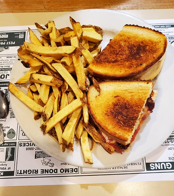 The grilled chicken sandwich arrives with a battalion of hand-cut fries&mdash;crispy soldiers ready to march straight into comfort food heaven.