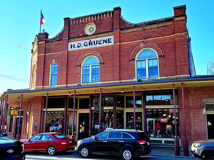The H.D. Gruene building stands proudly in its brick-and-mortar glory, a Victorian-era masterpiece that's outlived countless shopping malls.