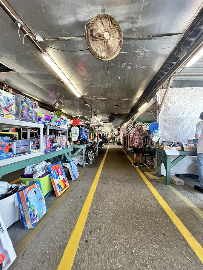 Ceiling fans whirl overhead as shoppers traverse the yellow-lined pathways. It's like a highway system for bargain hunters.