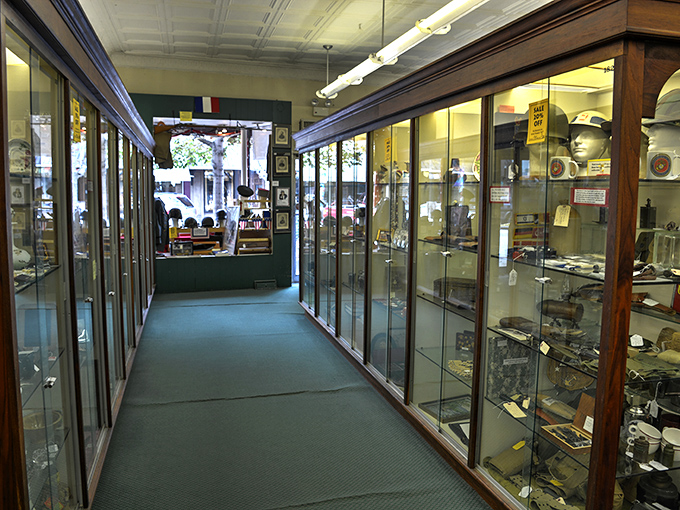 Display cases lining this hallway contain miniature museums of American life. Each glass pane separates you from touching history itself.
