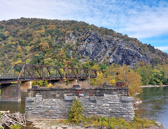 The quintessential Harpers Ferry postcard shot&mdash;historic architecture nestled between lush mountains and blue skies, no filter required.