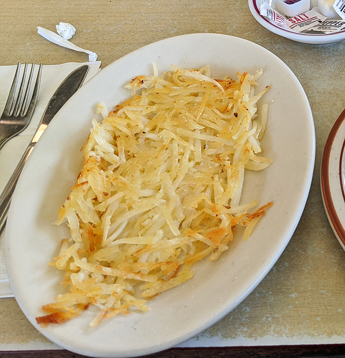 Hash browns done right&mdash;crispy, golden shreds that crackle with each bite. The potato in its most noble form, ready to support whatever breakfast dreams you're building.