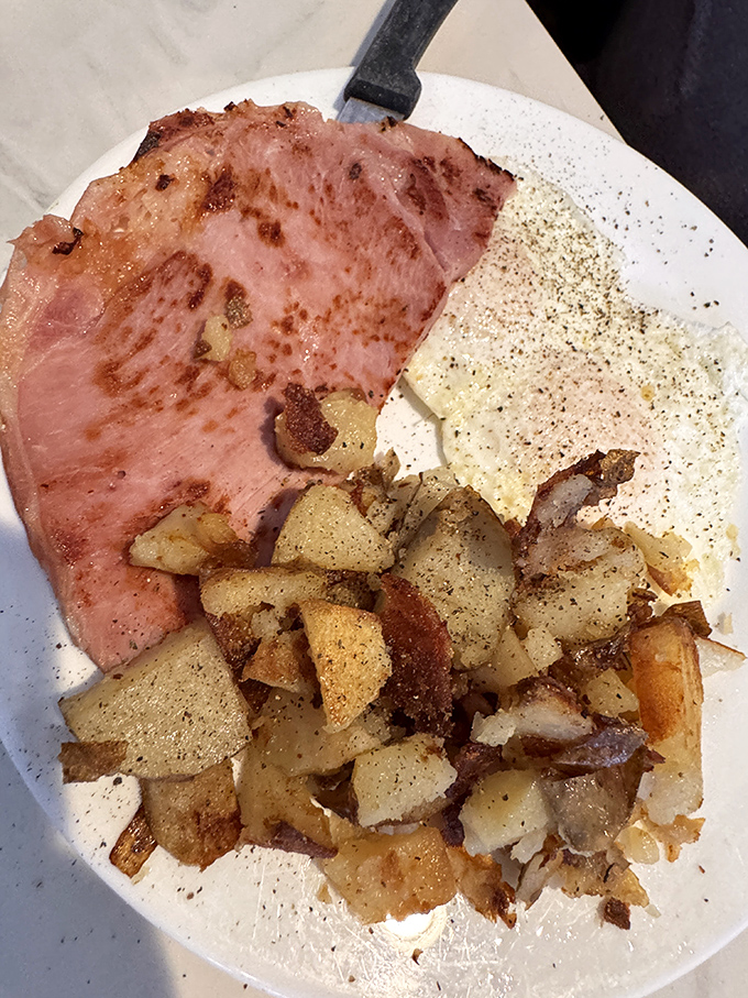 These home fries deserve their own zip code&mdash;crispy edges, tender centers, and seasoned with what must be some secret coastal Florida magic.