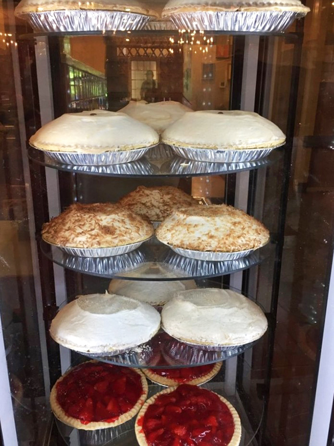 The pie case at Mehlman's stands as a monument to American dessert artistry. Those meringue peaks could qualify for their own national park designation.