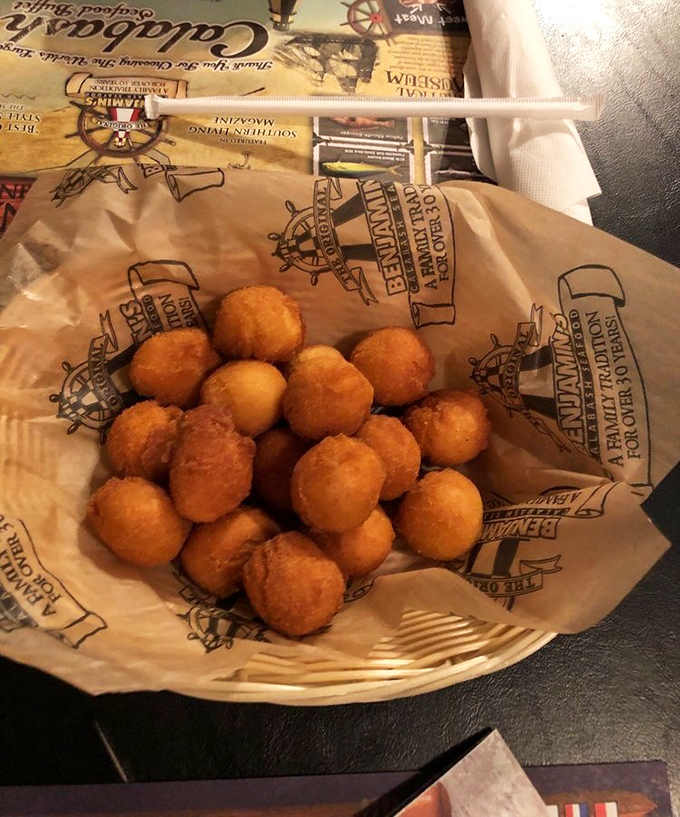 Golden orbs of cornmeal perfection – hush puppies that don't just accompany your seafood feast, they complete it. Resistance is futile.