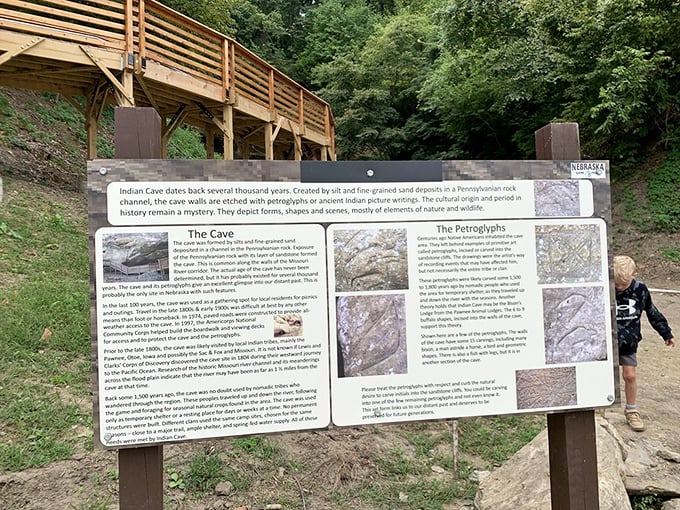 The informational sign reveals the park's ancient secrets. History class was never this interesting when you're standing where indigenous artists once created their masterpieces.