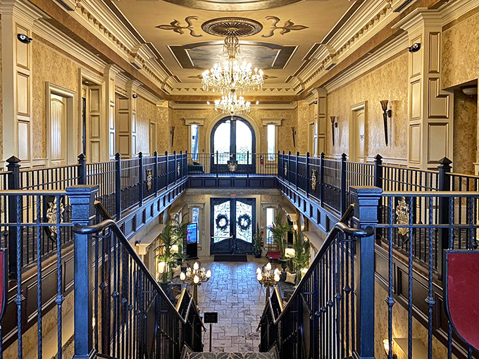 The grand staircase inside reveals an interior that screams "Downton Abbey meets Kentucky charm" with stunning chandeliers and elegant balustrades.
