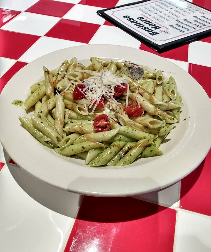 Pesto pasta that would make an Italian grandmother nod in approval. Those fresh tomatoes add pops of flavor like little taste explosions.