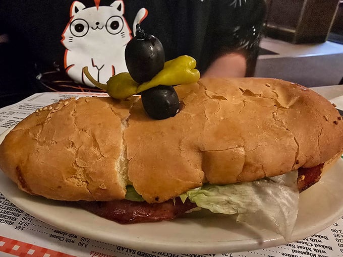 Not all heroes wear capes &ndash; some come on fresh Italian bread with olives, peppers, and a cute cat-shaped toothpick holder standing guard.