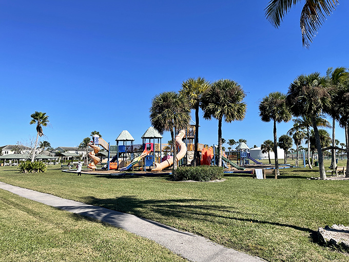 A playground where grandkids burn energy while grandparents burn considerably less on a bench in the shade.