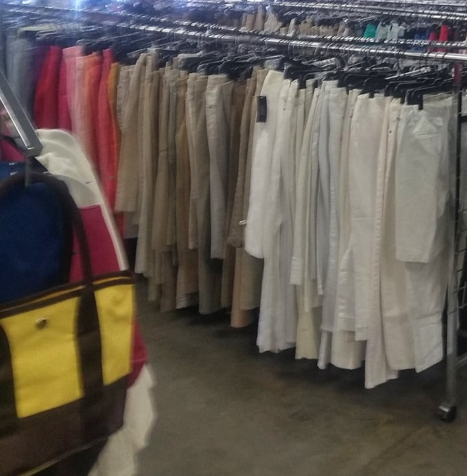 The pants section, organized by color like a fashionista's dream closet, proves that secondhand shopping isn't just economical &ndash; it's surprisingly civilized.