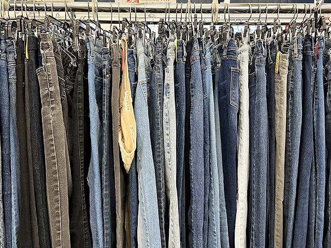 The denim wall&mdash;a blue jean symphony. Finding the perfect pair here is like discovering a hidden speakeasy in your favorite neighborhood.