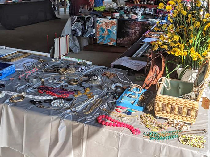 A rainbow of costume jewelry awaits new owners, arranged with the meticulous care of someone who knows baubles aren't just accessories&mdash;they're joy.