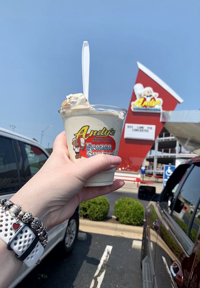That classic Andy's cup, held against the backdrop of its birthplace&mdash;proof that sometimes the simplest pleasures make the most memorable souvenirs.