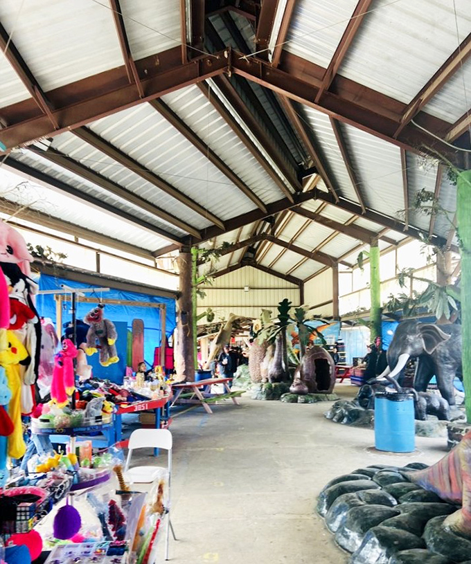 Prehistoric shopping companions watch over this section of the market. Who knew dinosaurs and stuffed animals could create such a bizarrely perfect retail ecosystem? 