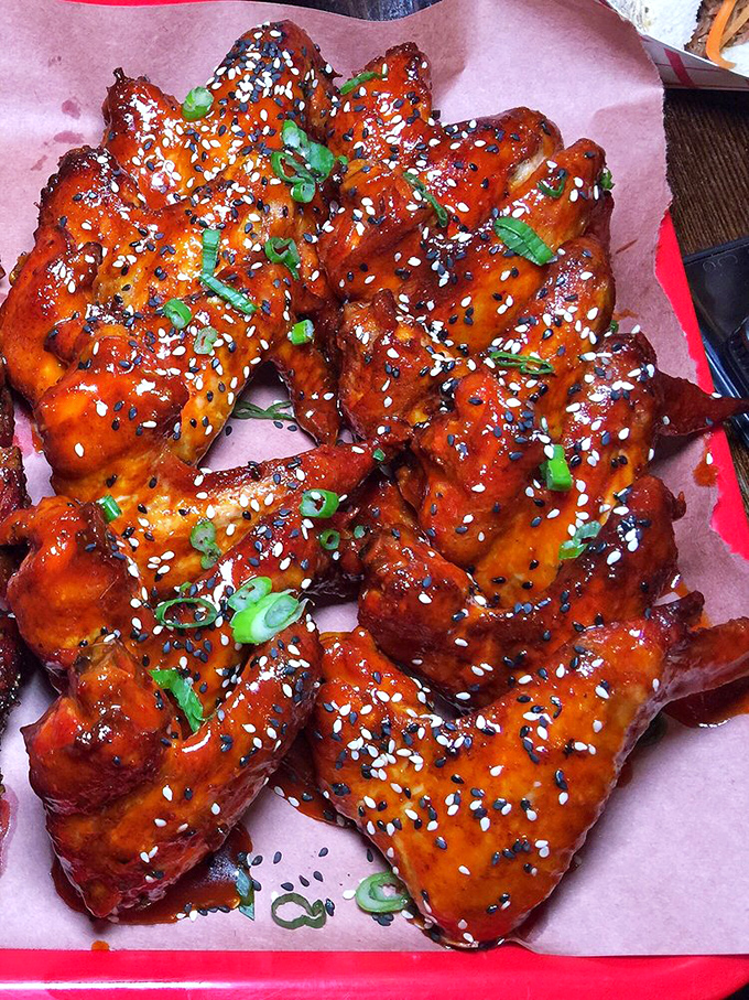 Korean wings that would make Seoul proud—glazed, garnished, and guaranteed to make you forget every other wing you've ever encountered.