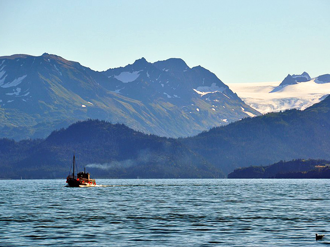 Mountains reflecting in waters so still they could be liquid glass. Alaska showing off again with that "I woke up like this" natural beauty.