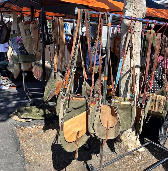 Canvas meets leather in this bohemian display where each weathered bag carries the patina of adventures yet to come.