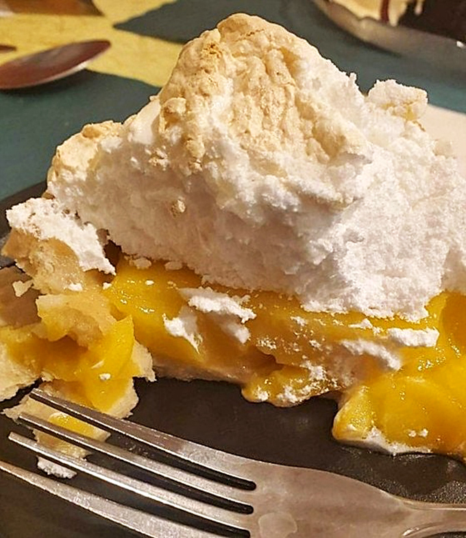A mountain of meringue crowns this sunshine-yellow lemon pie. It's the dessert equivalent of a standing ovation.