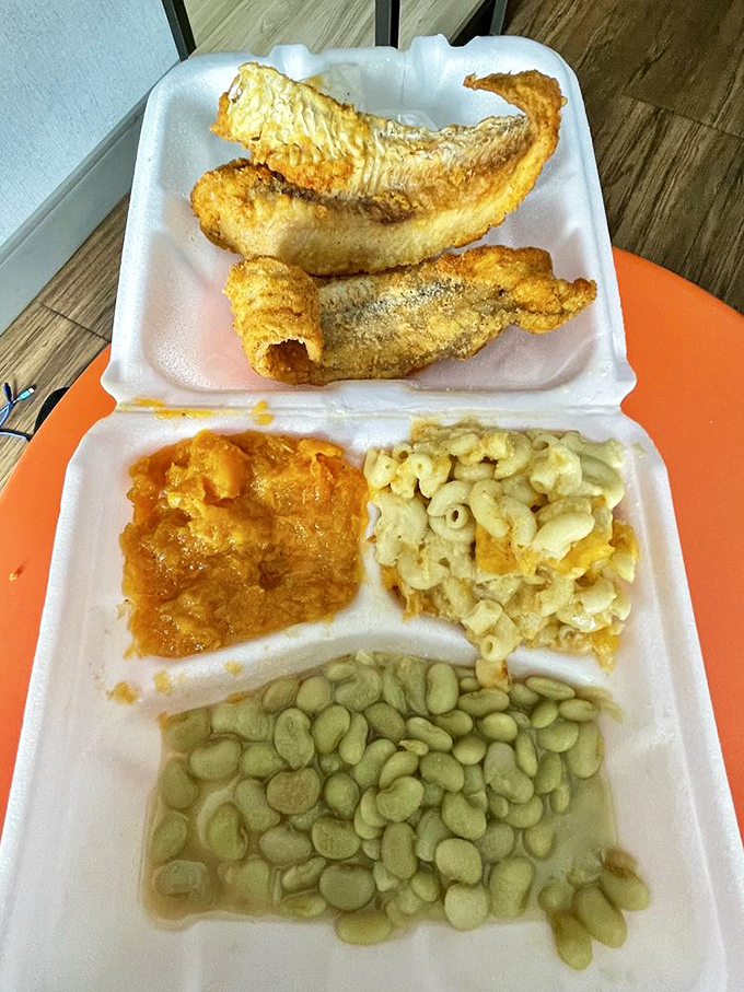Fried fish that would make Neptune himself swim to shore, flanked by mac and cheese, candied yams, and lima beans that taste like childhood memories.