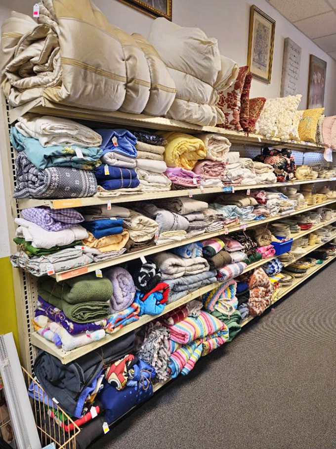 Blankets, pillows, and linens stacked with military precision &ndash; because someone's grandmother would accept nothing less from her household textiles.