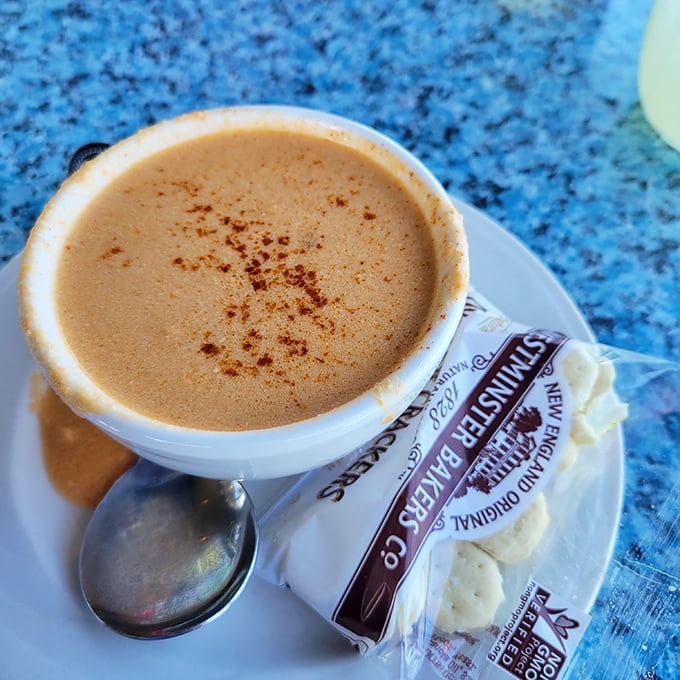 The legendary lobster bisque, sprinkled with paprika like a sunset over the Atlantic. Worth driving across state lines for.
