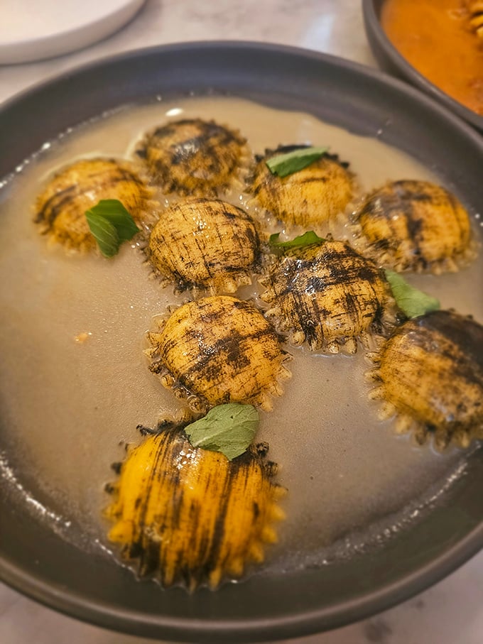 Lobster ravioli swimming in a buttery broth that you'll be tempted to drink straight from the bowl. No judgment here.