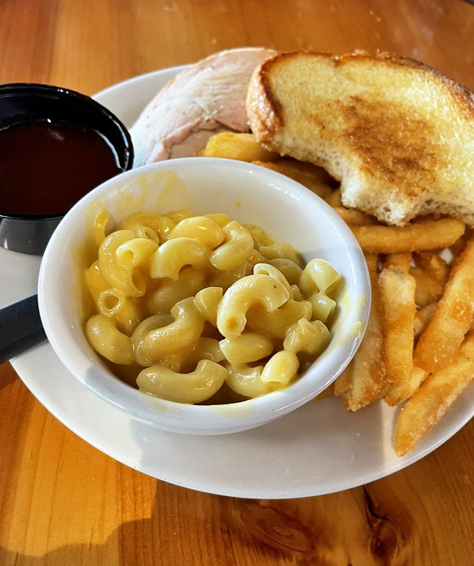 Mac and cheese that achieves that perfect balance between creamy and structured &ndash; like a relationship counselor who specializes in pasta therapy.