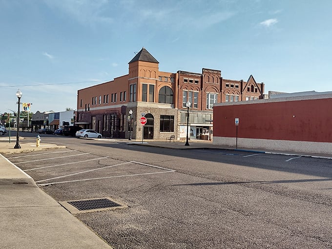 Historic buildings line Main Street like well-preserved sentinels, their brick facades telling stories of commerce from a more personal era.