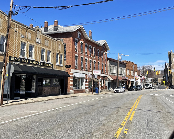 Black Rock Tavern anchors this stretch of historic buildings, where you can still find authentic conversation that doesn't require a Wi-Fi password.