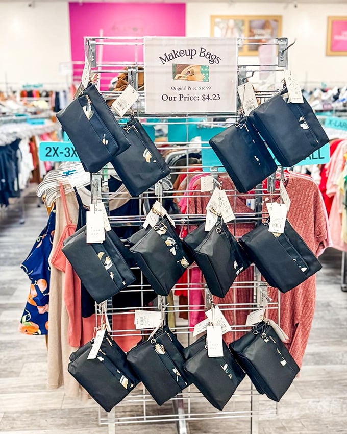 Black makeup bags hang like fashionable fruit, ready to be plucked by savvy shoppers who know organization is the first step to beauty domination.