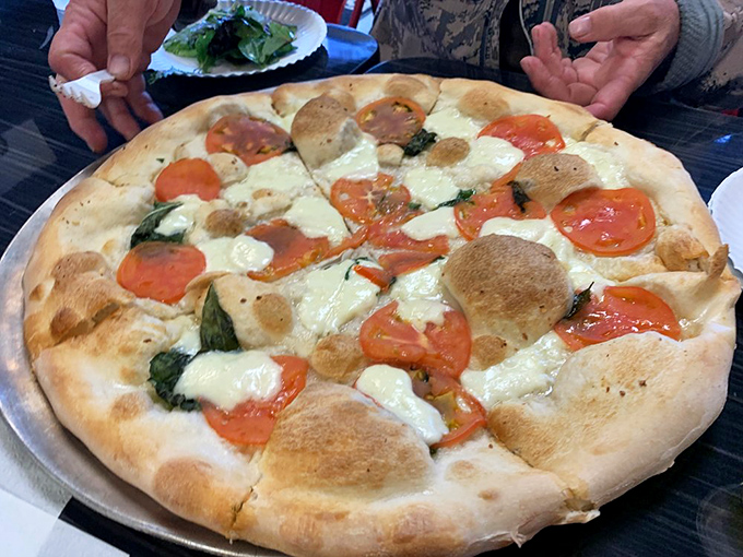 Fresh tomatoes and basil on a perfectly charred crust&mdash;sometimes simplicity is the most sophisticated choice you can make.