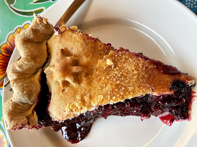 Marionberry pie that makes you understand why people write songs about dessert. That crimson filling practically sings against the golden crust.