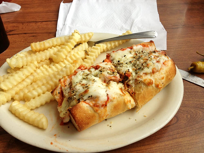 The meatball sub&mdash;where Italian tradition meets Midwest generosity. Those crinkle-cut fries aren't just sides, they're supporting actors deserving their own award.
