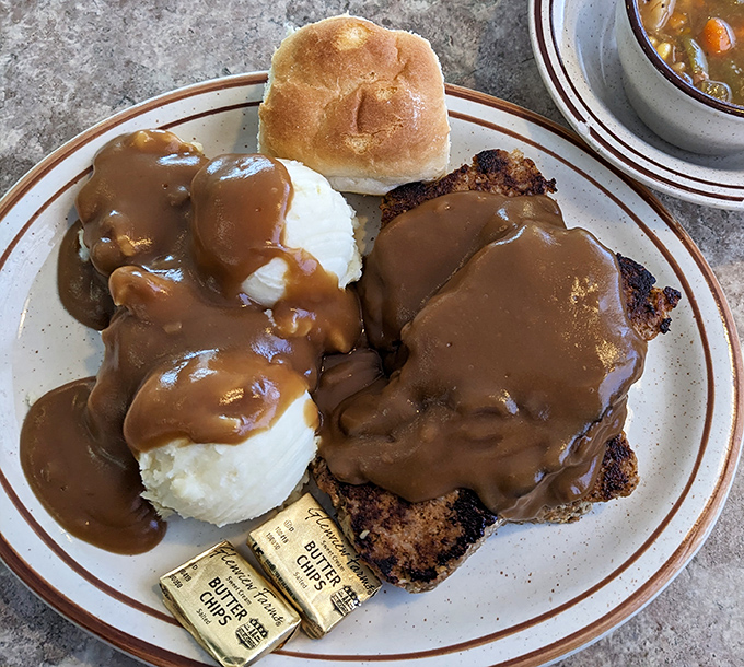 Meatloaf and mashed potatoes smothered in gravy – the kind of plate that makes you want to call your mother and apologize for saying hers was the best.