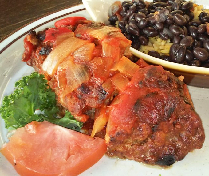 Meatloaf wrapped in bacon? Someone's grandmother is smiling down from heaven. Served with black beans and rice for a Florida twist on comfort.