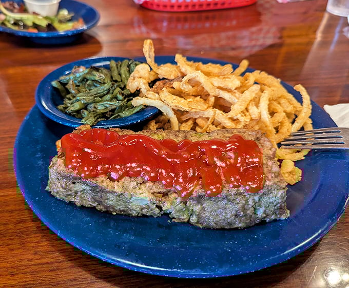 Blue plate special alert! Homestyle meatloaf smothered in tangy sauce with crispy onion straws and green beans&mdash;grandma would approve.
