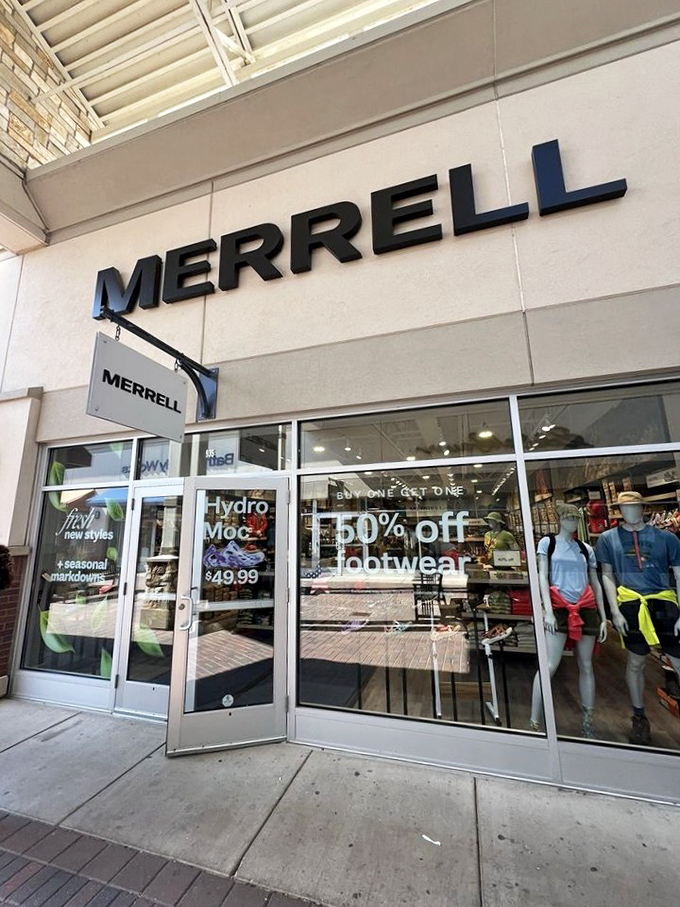 Merrell's window display showcases outdoor gear at 50% off&mdash;because conquering Minnesota trails shouldn't require conquering your credit limit.
