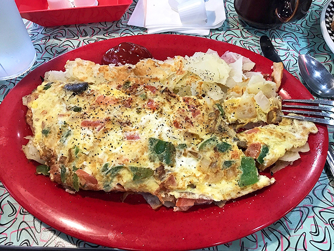 The Mexican Omelet arrives like a colorful canvas, each vegetable adding both flavor and visual pop to your morning.