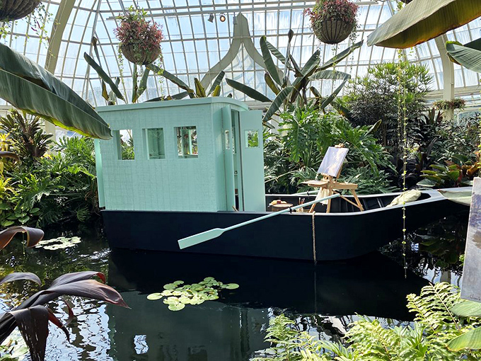 This whimsical boat floating among lily pads isn't waiting for passengers&mdash;it's living its best life as the most photographed spot in the conservatory.