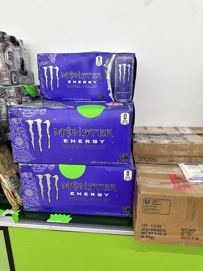 Monster Energy drinks stacked like purple gold. Someone's all-nighter study session or gaming marathon is about to get significantly cheaper.