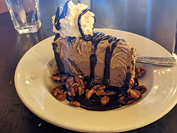 A chocolate dessert that doesn't just satisfy your sweet tooth – it throws a party for it, complete with candied nuts and a chocolate drizzle tuxedo.