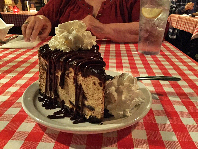 The mud pie doesn't whisper "dessert" – it shouts it from the mountaintop. That chocolate avalanche with whipped cream peaks could feed a small hiking party.