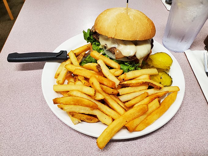 This isn't just any burger&mdash;it's the reason lunch at a breakfast joint makes perfect sense. Golden fries, melty cheese, and a bun that means business.