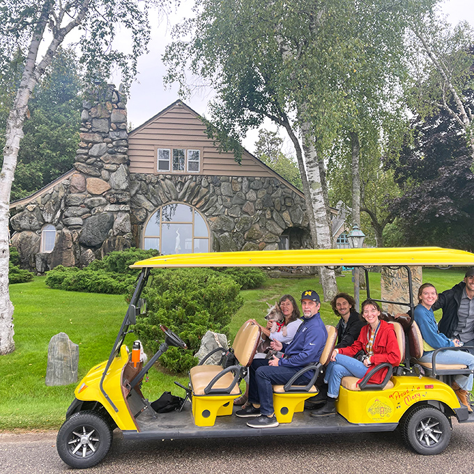 "How do we tour the mushroom houses?" Just hop on this yellow chariot and prepare for architecture that defies both gravity and convention.