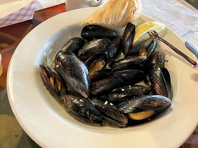 A bowl of mussels that would make a New Englander homesick, steamed to perfection and ready for their butter bath.