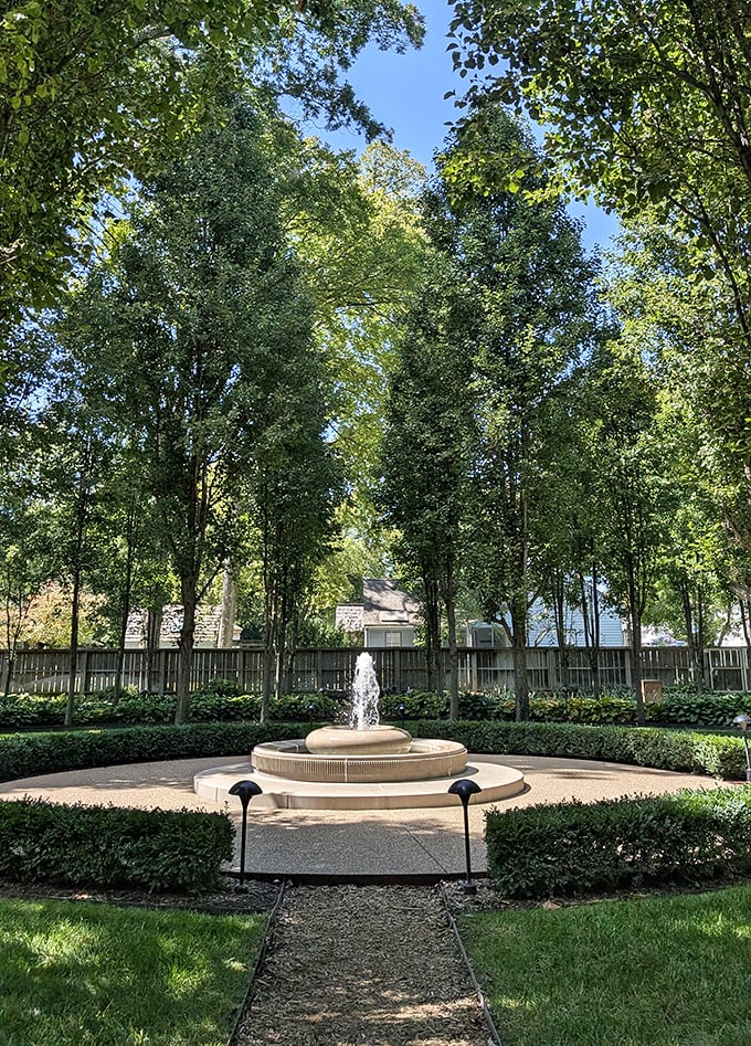 This meticulously maintained garden fountain creates a perfect circle of serenity, surrounded by greenery that would make any meditation guru jealous.