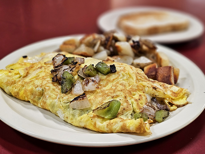 An omelet that doesn't need to show off&mdash;just perfectly executed with green peppers and onions folded into fluffy eggs.