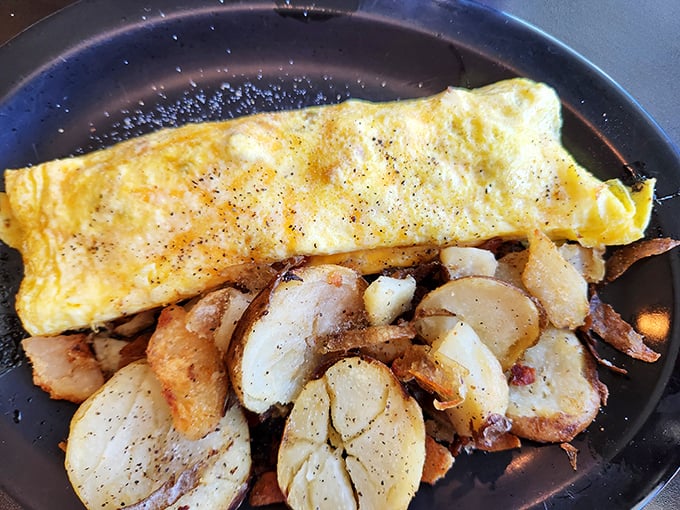 Behold the omelet that launched a thousand road trips. Perfectly folded egg blanket covering a treasure of fillings.